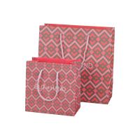 China PP Twist Handle Paper Packaging Bags 230gsm White Kraft Paper Material for sale
