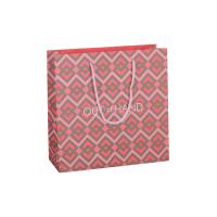 China PP Twist Handle Paper Packaging Bags 230gsm White Kraft Paper Material for sale
