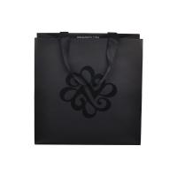 China Customized UV Coating Paper Packaging Bags With Flat Cotton Handle for sale