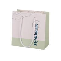 China Shopping Custom Printed Paper Bags Art Paper Matte Lamination With Nylon Rope Handle for sale