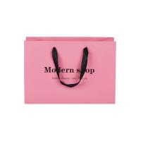 China Pink 250g Coated Paper Bags Packaging Clothing With Ribbon Handle for sale