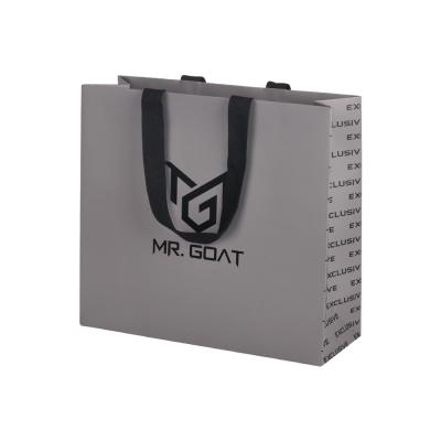 China Grey UV Art Paper Gift Bags Clothing Shopping Packaging With Handle for sale