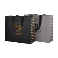 China Grey UV Art Paper Gift Bags Clothing Shopping Packaging With Handle for sale