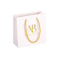 China 100gsm Gold Stamping White Paper Bags Business Shopping Packaging With Handle for sale