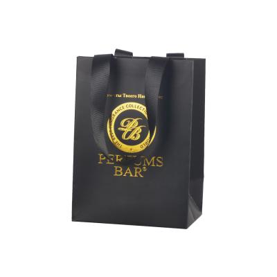 China Gold Stamping Black Paper Bags Shopping Packaging With Ribbon Handle for sale
