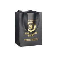 China Gold Stamping Black Paper Bags Shopping Packaging With Ribbon Handle for sale
