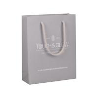 China Offset Printing Grey Gift Paper Bags Shopping Packaging With Cotton Rope Handle for sale