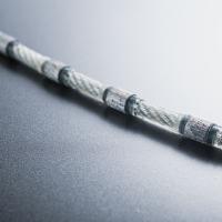China Plastic Dia 8.3mm 9.0mm Wire Rope Diamond Beads for Stone Profiling Cutting Trimming for sale