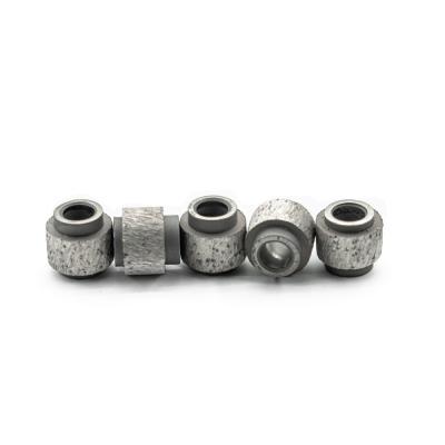 China Cutting Spare Parts Sintering Diamond Wire Saw Beads for Stone Cutting Applications for sale