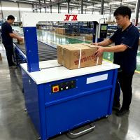 China Semi Automatic PP Band Strapping Machine 15mm Width 60kg Tension Roller Table for sale