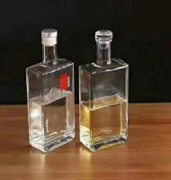 China Custom Design 500ml 750ml Square Glass Vodka Bottle with Cap for sale