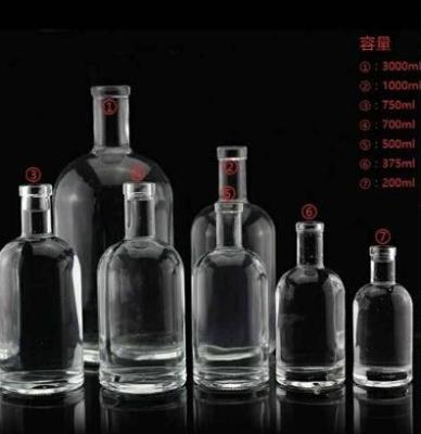 China Super Flint Glass Material 700ml Clear Long Neck Vodka Glass Bottle with Cork for sale