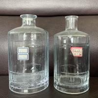 China Custom 750ml Embossed Logo Wine Glass Bottle in Clear Color for Branded Whisky for sale