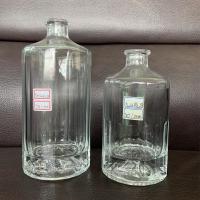 China Custom 750ml Embossed Logo Wine Glass Bottle in Clear Color for Branded Whisky for sale
