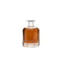 China Custom 750ml Embossed Logo Wine Glass Bottle in Clear Color for Branded Whisky for sale