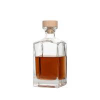 China Custom 750ml Embossed Logo Wine Glass Bottle in Clear Color for Branded Whisky for sale