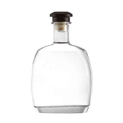 China 750ml empty vodka gin glass bottles with cork made of super flint glass material for sale
