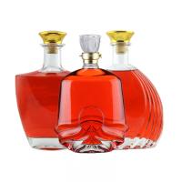 China Bottle Material Super flint glass material 700ml vodka whisky glass bottle with stopper for sale
