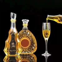 China Bottle Material Super flint glass material 700ml vodka whisky glass bottle with stopper for sale