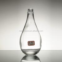 China Deep Process Hot Stamping Glass Bottle for Wine in Water Drop Shape for sale