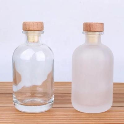 China Tequila Custom Empty Tall Round Glass Boston Gin Bottle with Cork/Caps for sale
