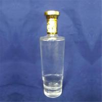 China Free Sample 500 ml 750 ml Glass Round Liquor Bottle with Cork Sealing Type for sale