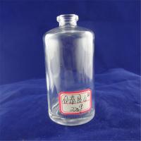 China Free Sample 500 ml 750 ml Glass Round Liquor Bottle with Cork Sealing Type for sale