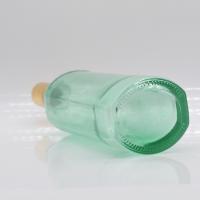 China Super Flint Glass Whiskey Rum Gin Bottles with Custom Relief Carving Design and Wooden Stopper for sale