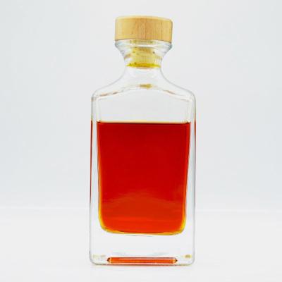China Paypal Payment Accepted Clear Glass Bottle for Alcoholic Beverages for sale