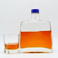China 750ml Custom Glass Bottle for Spirits Transparent Irregular Shaped Tequila Bottle for sale