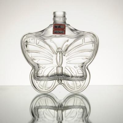 China 500ml Frost Surface Handling Butterfly Shape Whiskey Glass Bottle for Vodka Packaging for sale