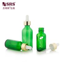 China Luxury Collar 1oz 2oz Green Glass Dropper Bottle for Essential Oil for sale