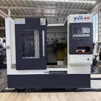 China Slant Bed CNC Lathe Tck40 CNC Lathe Machine CNC Lathe With Bar Feeder for sale