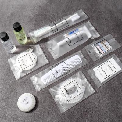 China Hotel Toiletries Kit 12-Piece Disposable Travel Amenities Set with Toothbrush Shaving Kit Comb Slipper for sale