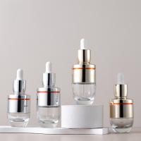 China 30ml 50ml Gold/silver spray essence bottle, essential oil glass bottle, electroplating uv shoulder sleeve dropper bottle for sale
