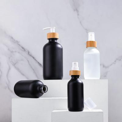 China Black Matte Bamboo Wood Cover Glass Bottle 30ml60ml90ml120ml240ml480ml Body Lotion Hand Sanitizer Bottle Press Pump cap for sale