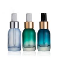 China New thick bottom30ml 50ml skin care essence flat shoulder glass bottles cylindrical gradient color essential oil dropper for sale