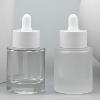 China Transparent/Frosted Super Thick Bottom Flat Shoulder Round 30ml Serum Essence Pump Dropper Glass Bottles for sale