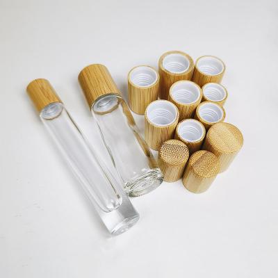 China 5ml 10ml Essential Oil Bottle With Stainless Steel Roller Ball Bamboo Top Eye Cream Roll On Glass Bottle With Bamboo Cap for sale
