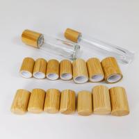 China 5ml 10ml Essential Oil Bottle With Stainless Steel Roller Ball Bamboo Top Eye Cream Roll On Glass Bottle With Bamboo Cap for sale
