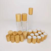 China 5ml 10ml Essential Oil Bottle With Stainless Steel Roller Ball Bamboo Top Eye Cream Roll On Glass Bottle With Bamboo Cap for sale