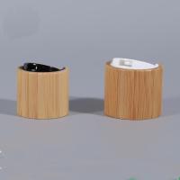 China 20/410 Wooden Bamboo Bottle Cap 24/410 Plastic Shampoo Disc Top Cap Nature Bamboo Flip Top Cap for sale
