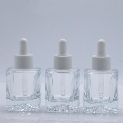 China 20ml 30ml 50ml Clear Flat Square Thick Bottom Serum Glass Dropper Bottle with White Lid for sale