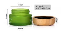 China Cream bottle with bamboo lid, cosmetic packaging material, round thick transparent glass cream bottle, 50g container for sale