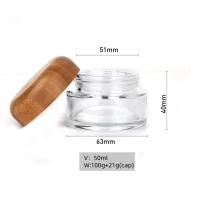 China Cream bottle with bamboo lid, cosmetic packaging material, round thick transparent glass cream bottle, 50g container for sale