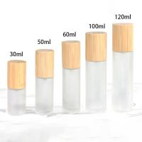 China 30ML/50ML/60ML/100ML/120ML bamboo bottle glass flat shoulder luxury cosmetic packaging bamboo cover for glass spray pump for sale
