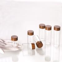 China 24mm, 28mm, 30mm, 65 sealed tube, glass transparent leak-proof bottle, glass 20ml bottle with wood grain plastic cap for sale