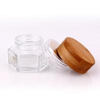 China 100ml cream bottle, glass cosmetic bottle, polygonal glass bottle with bamboo lid for sale