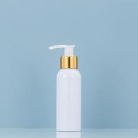 China 100ml white pump bottle shampoo white bottle body with gold/silver pump head for sale