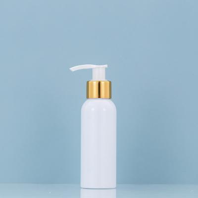 China 100ml white pump bottle shampoo white bottle body with gold/silver pump head for sale